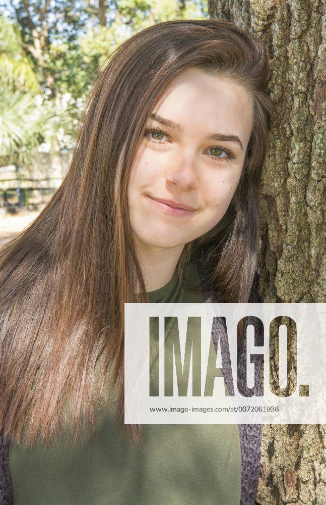 Young Teenage Girl Age 15 Testimonial Portrait With Tree Happy Teen